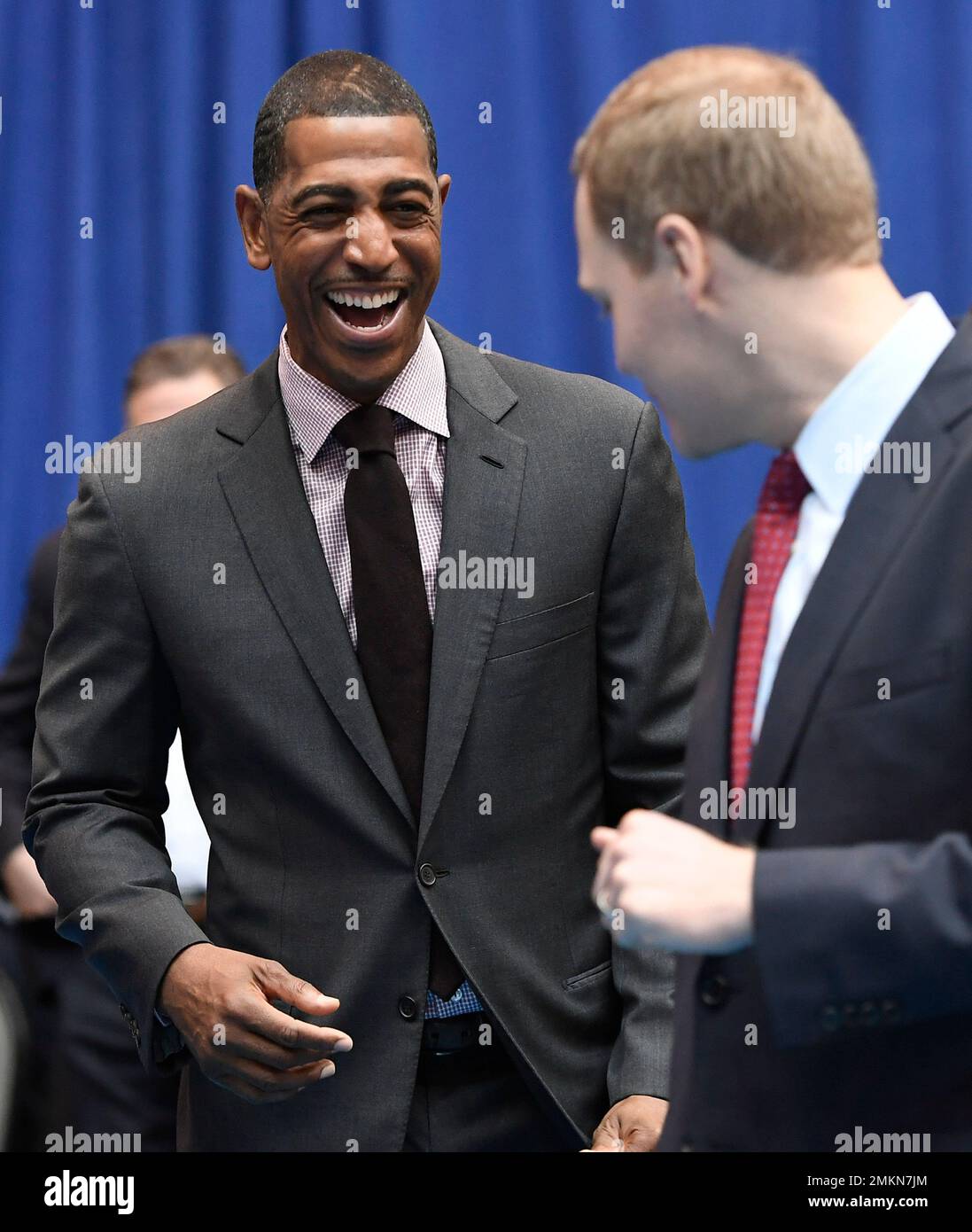 Former Connecticut men's basketball coach Kevin Ollie laughs as he ...