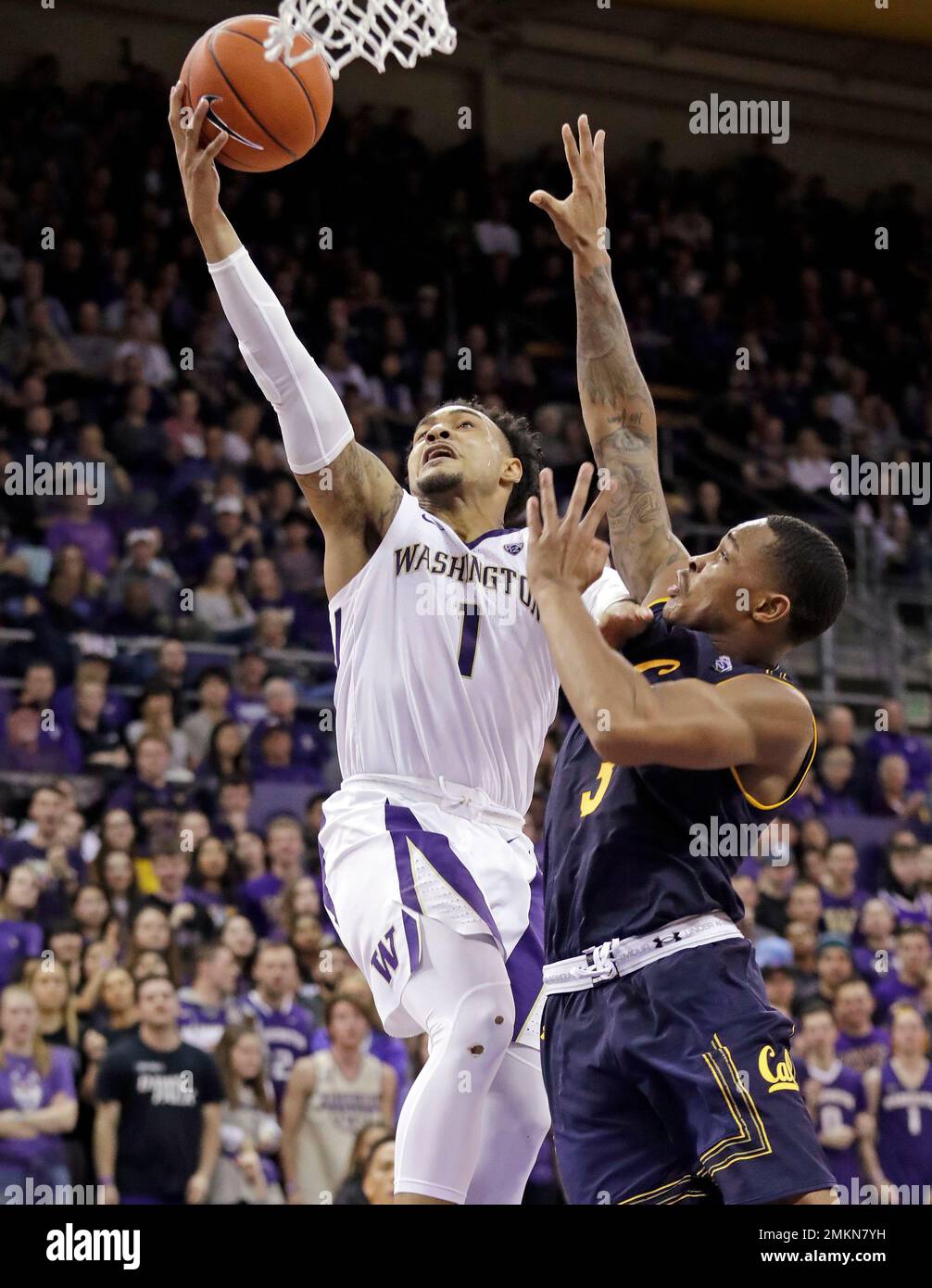 California's Paris Austin, right, fouls Washington's David Crisp as ...