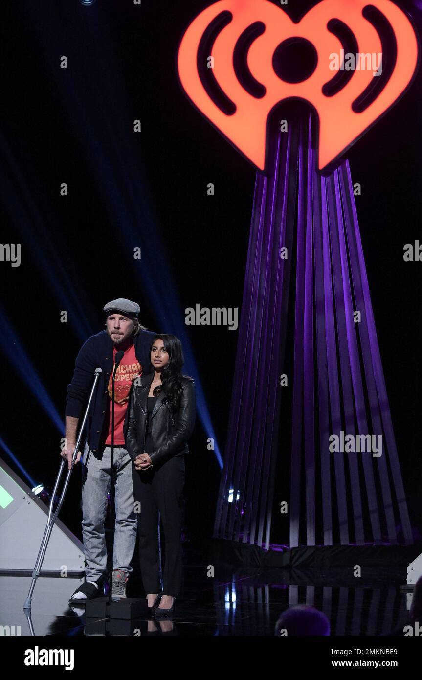 Dax Shepard, left, and Monica Padman speak onstage during the 2019 ...