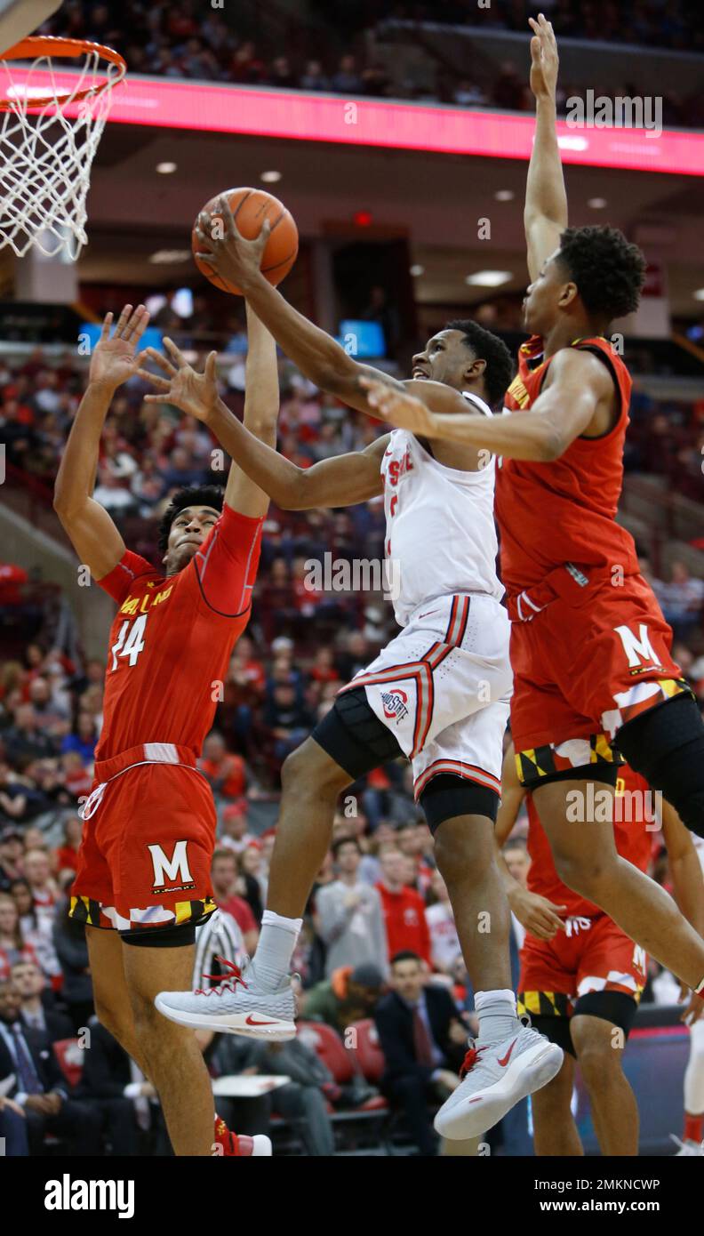 Ohio State's C.J. Jackson, center, shoots between Maryland's Ricky ...