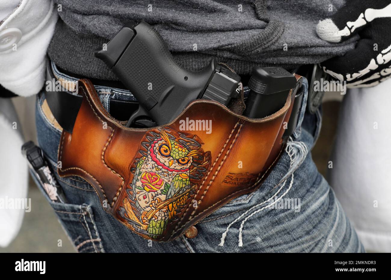 Jessica Marshall, of Roy, Wash., wears a Glock 9mm pistol in a holster ...