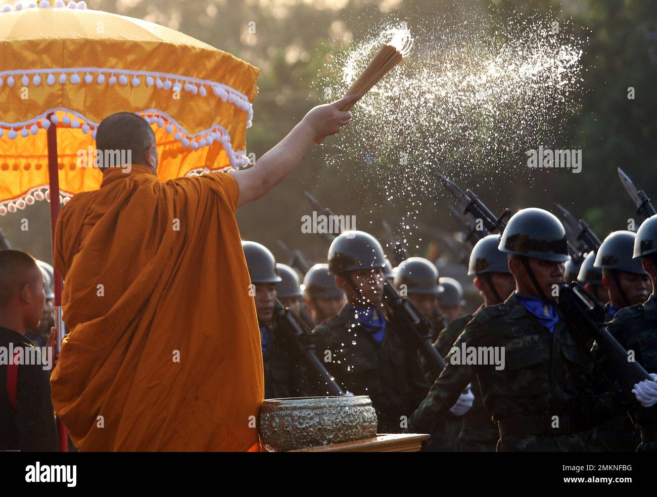 A Buddhist monk splashes holy water to Thai soldiers during the Royal ...