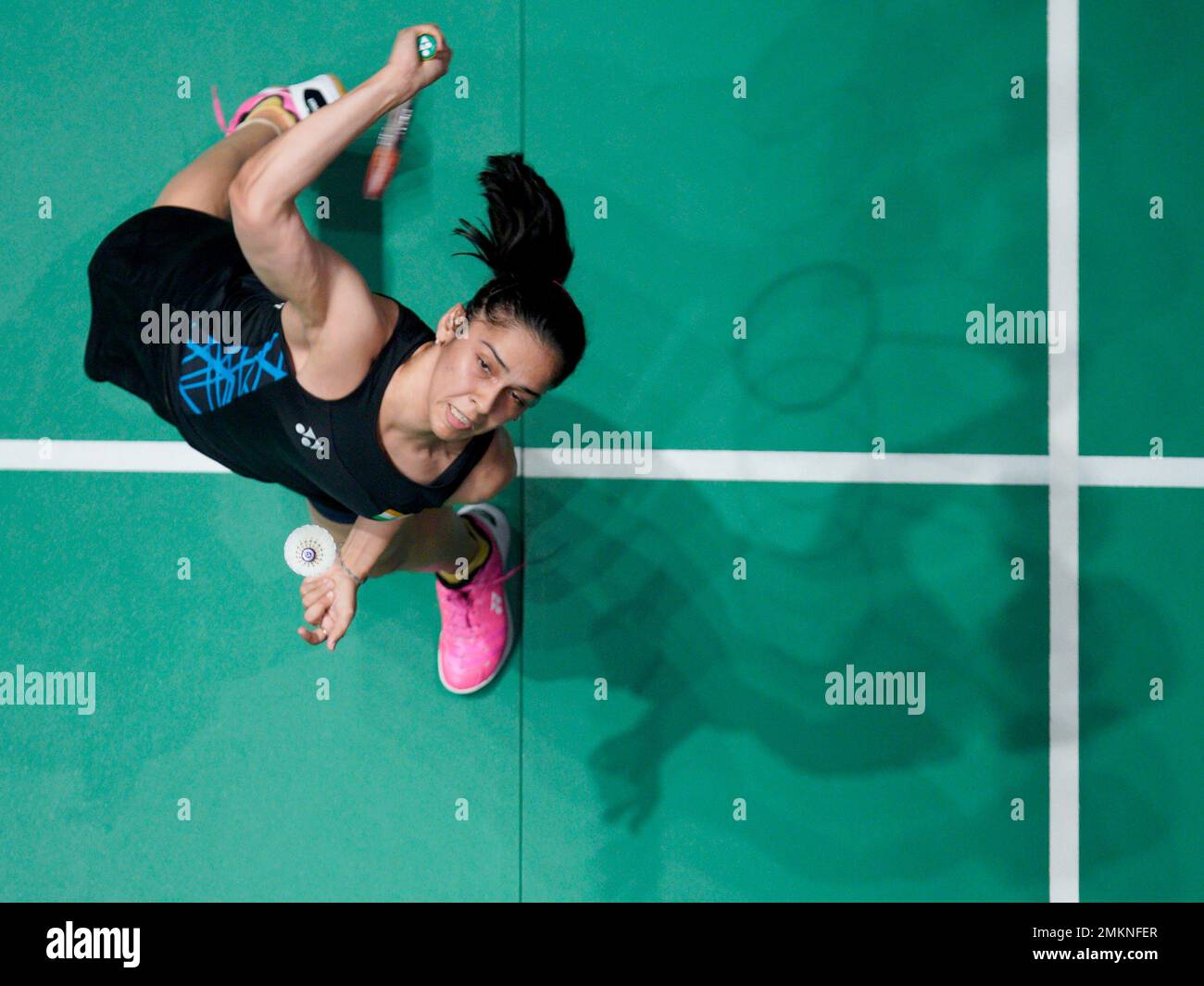 Sauna Nehwal of India returns a shot to Nozomi Okuhara of Japan during ...