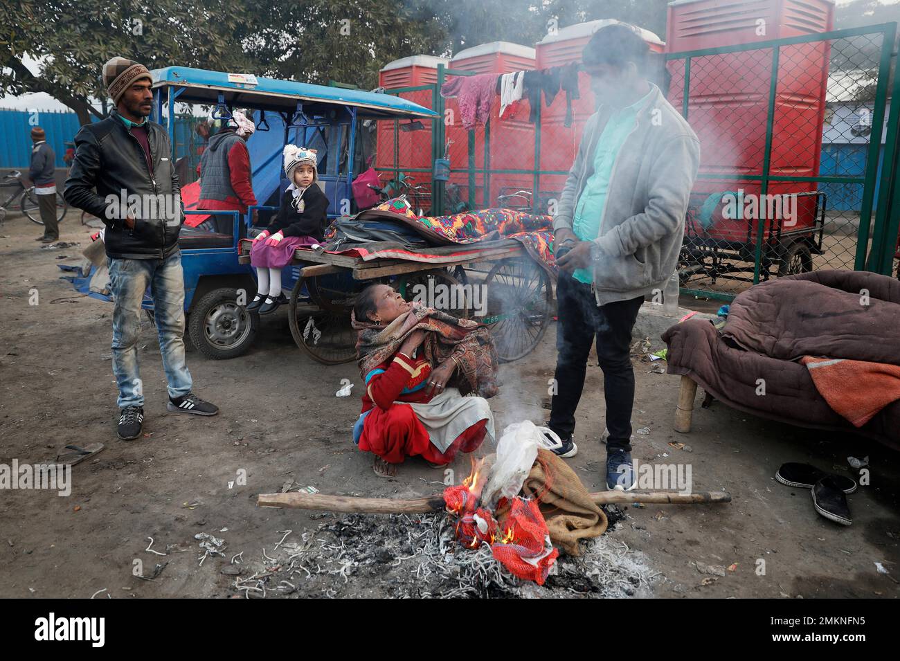 Child of a homeless family sits on a hand cart waits to leave for ...