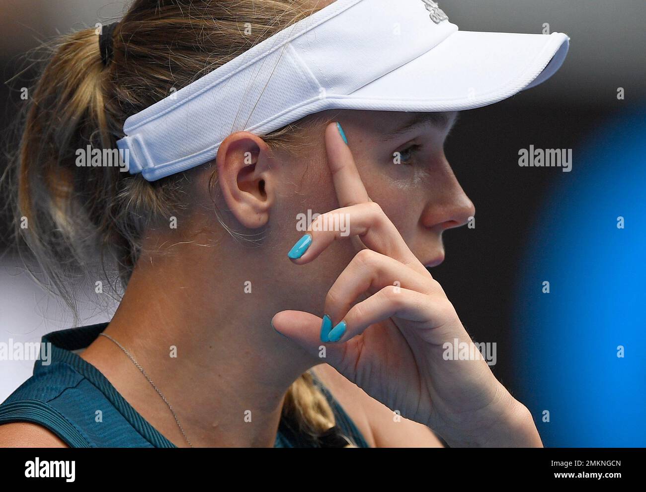 Denmark's Caroline Wozniacki wipes the sweat from her face during her ...