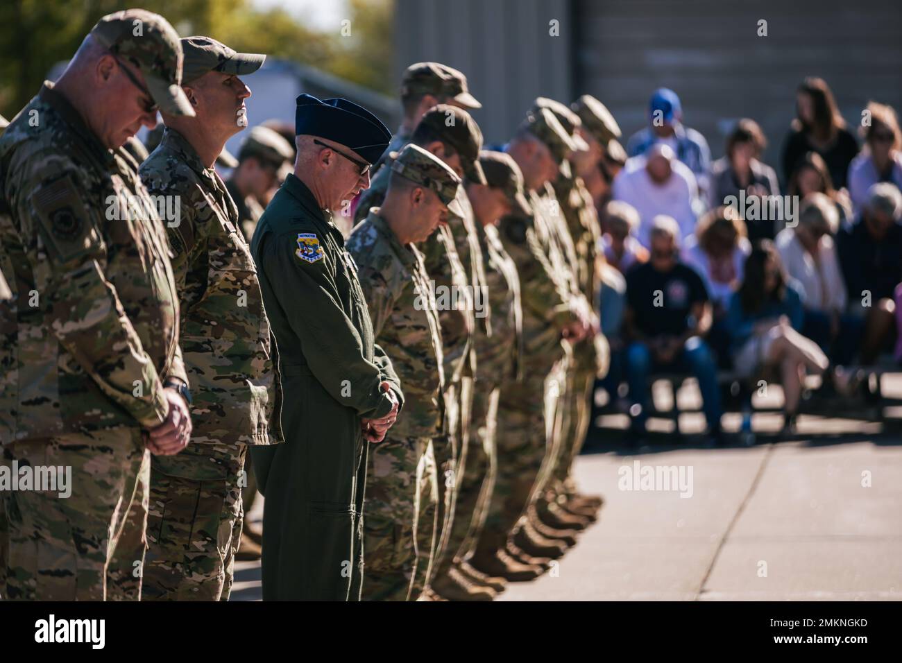Airmen of the 139th Airlift Wing bow their heads at a deployers ...