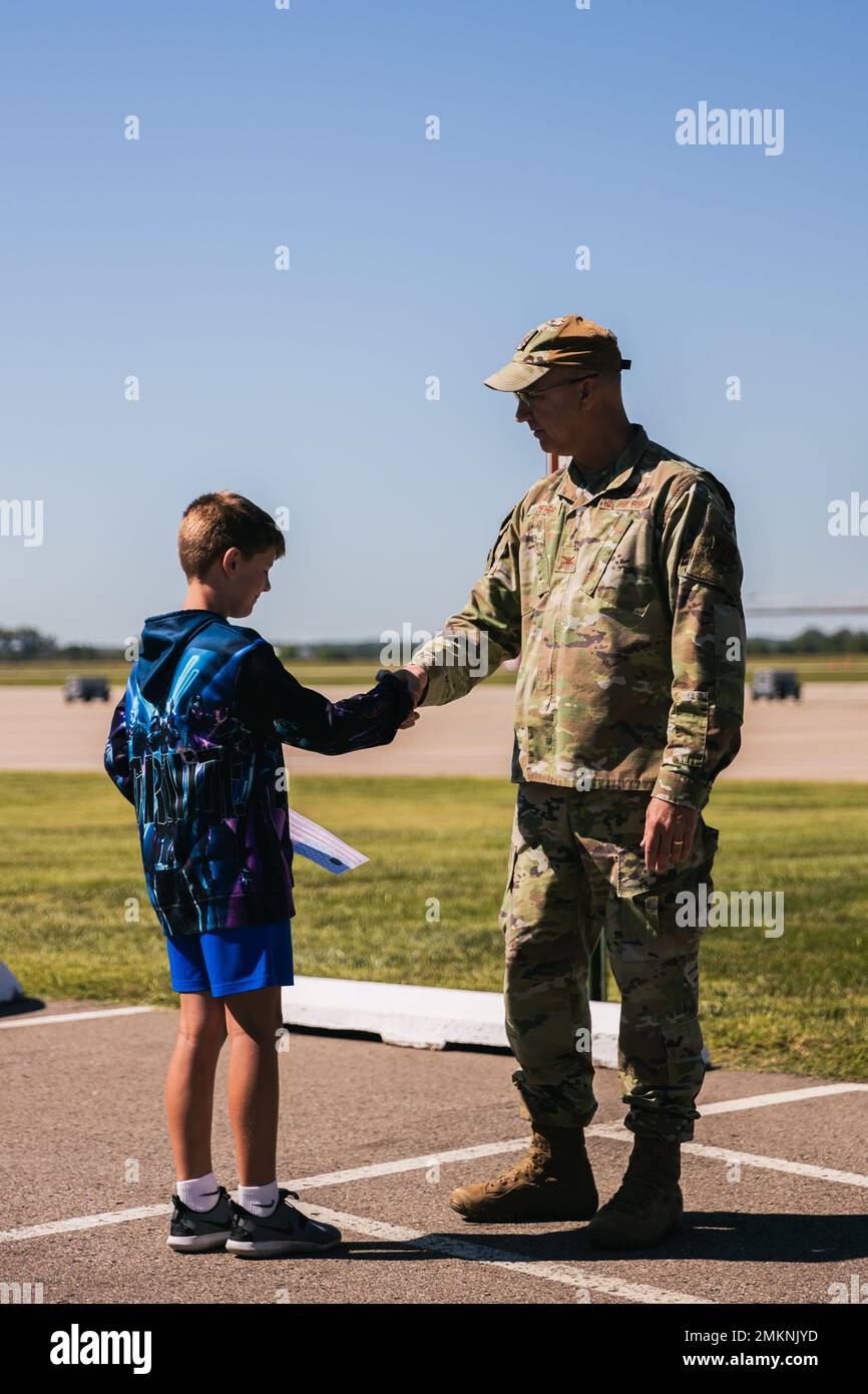 U.S. Air Force Col. Gordon Meyer presents the Home Front Hero Award to ...