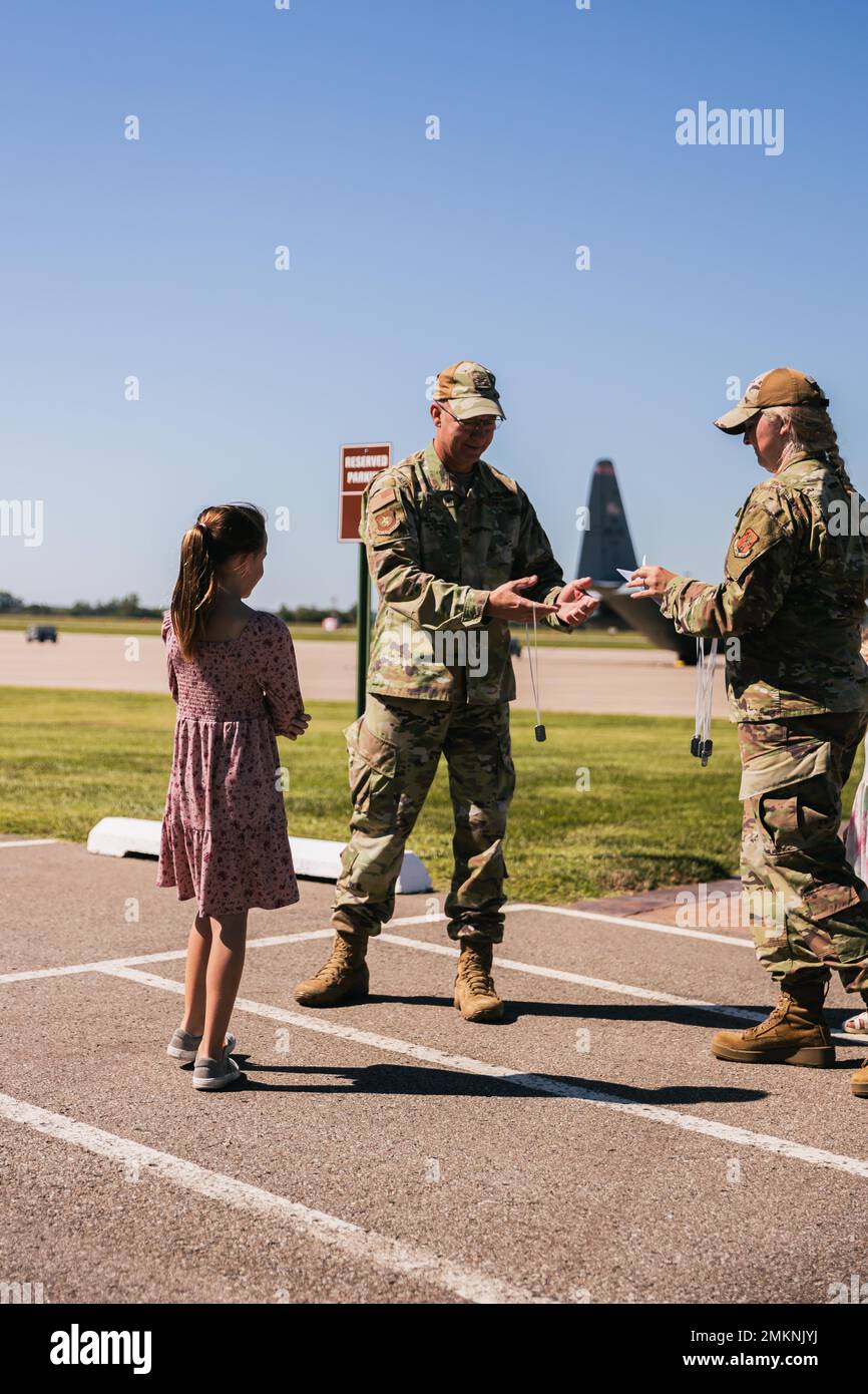 U.S. Air Force Col. Gordon Meyer presents the Home Front Hero Award to ...