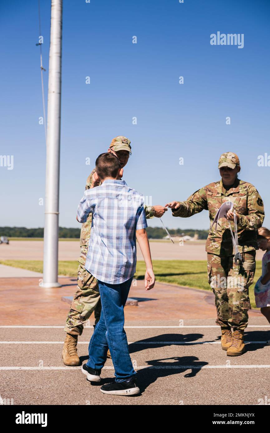 U.S. Air Force Col. Gordon Meyer presents the Home Front Hero Award to ...