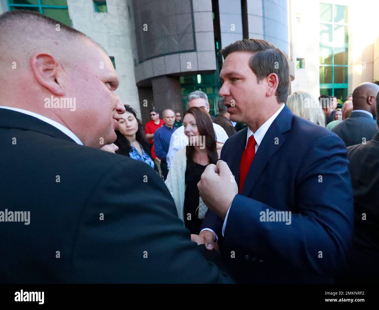 Florida Gov. Ron DeSantis, right, shakes hands with supporters and ...