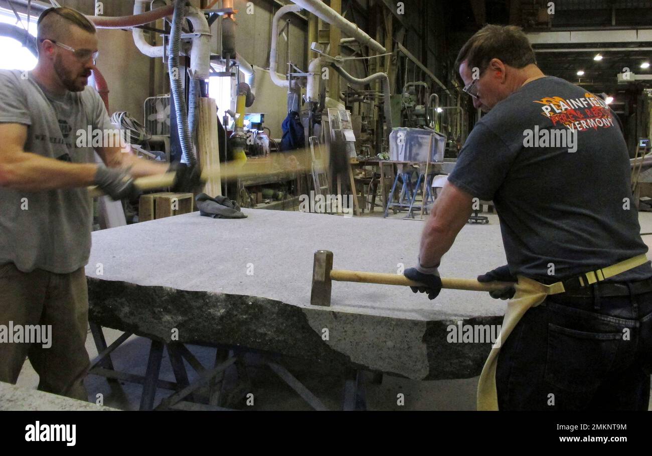 In this Tuesday, Jan. 8, 2019 photo, stone cutters Evan Ladd, left, and ...