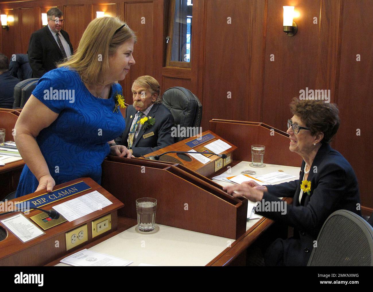 Alaska state Rep. Tammie Wilson, left, speaks with Rep. Gabrielle ...