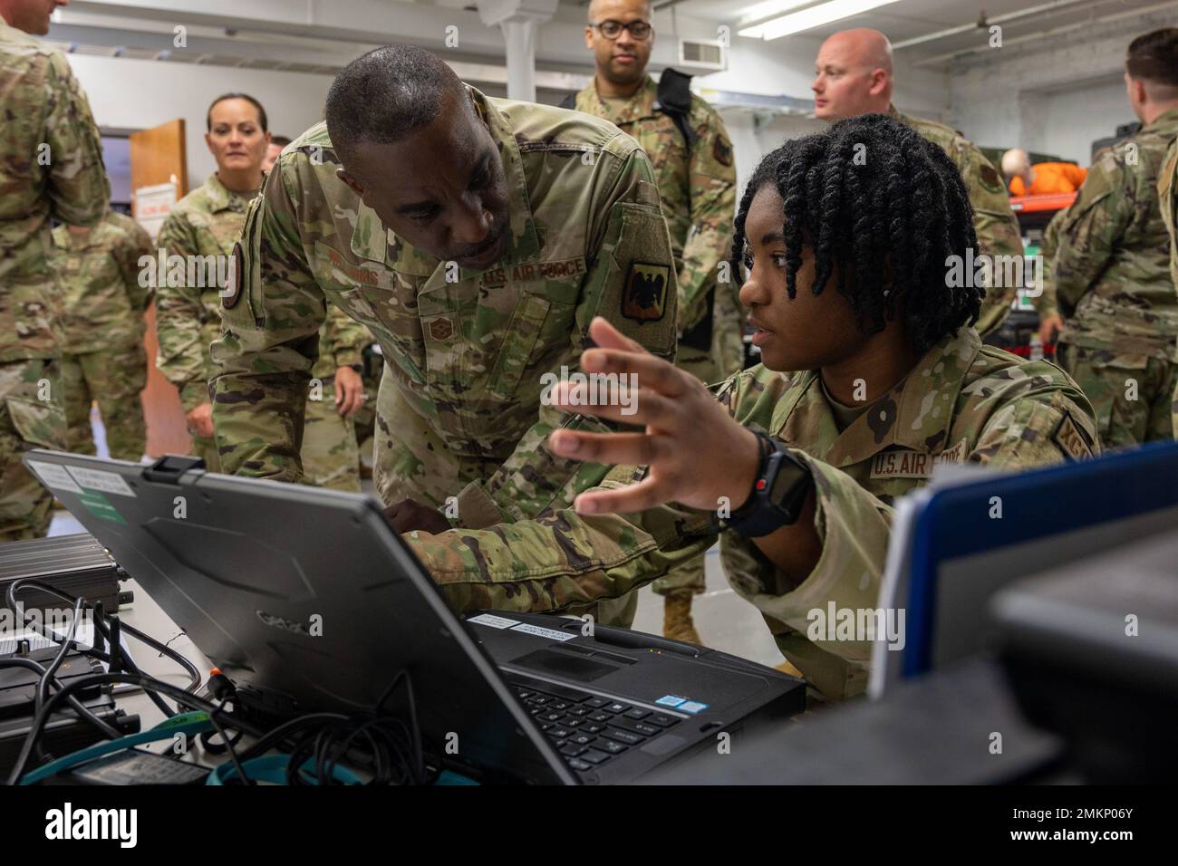 U.S. Air Force Chief Master Sgt. Maurice Williams, center, command ...