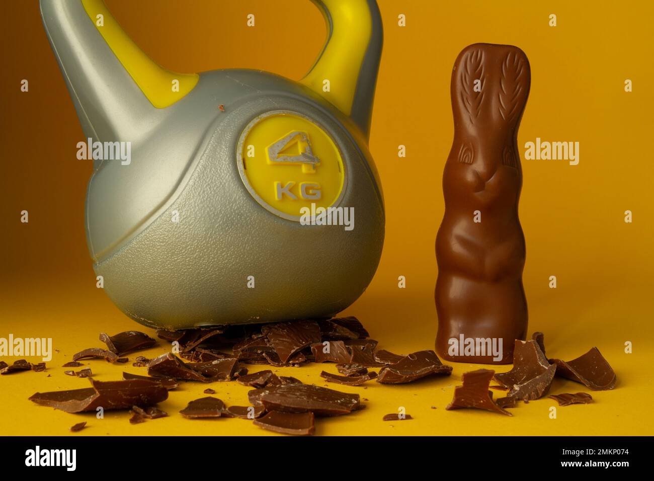 Kettlebell crushing Easter chocolate bunny. Gym workout, fitness ...