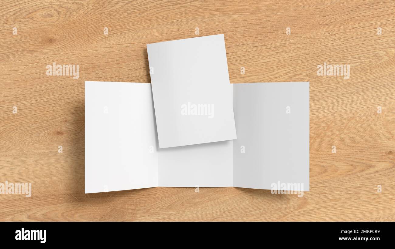 Trifold brochure A4 booklet mockup on wooden background Stock Photo - Alamy