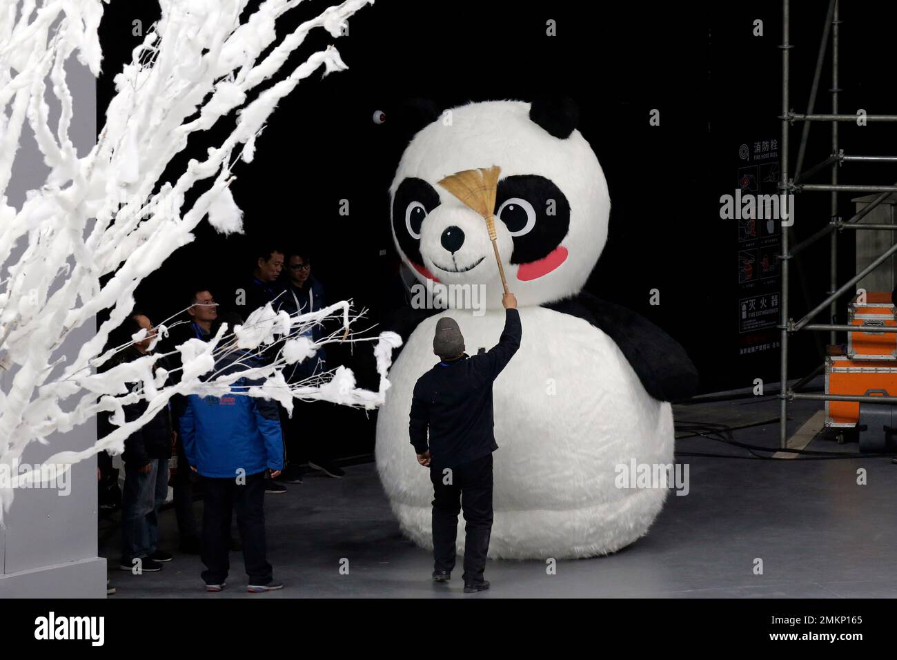 A worker prepares a panda mascot for the opening ceremony of 2019 Sino ...