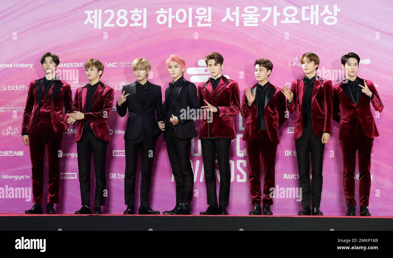 Members of South Korean K-Pop group NCT 127 pose for photos on the red ...