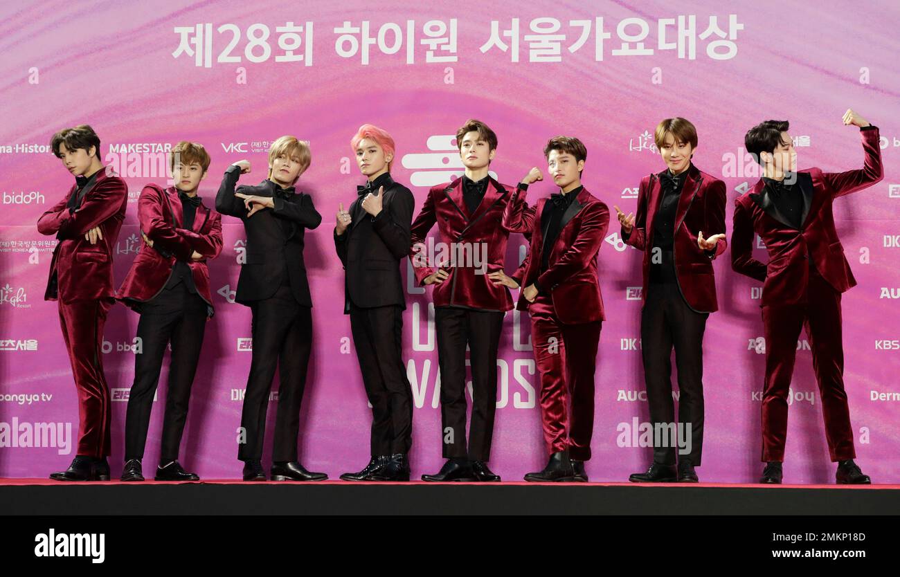Members of South Korean K-Pop group NCT 127 pose for photos on the red ...