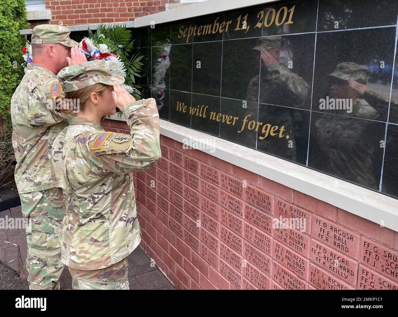 Lt. Col. Amanda Miller and Command Sgt. Maj. Gregory Dirks pay their ...
