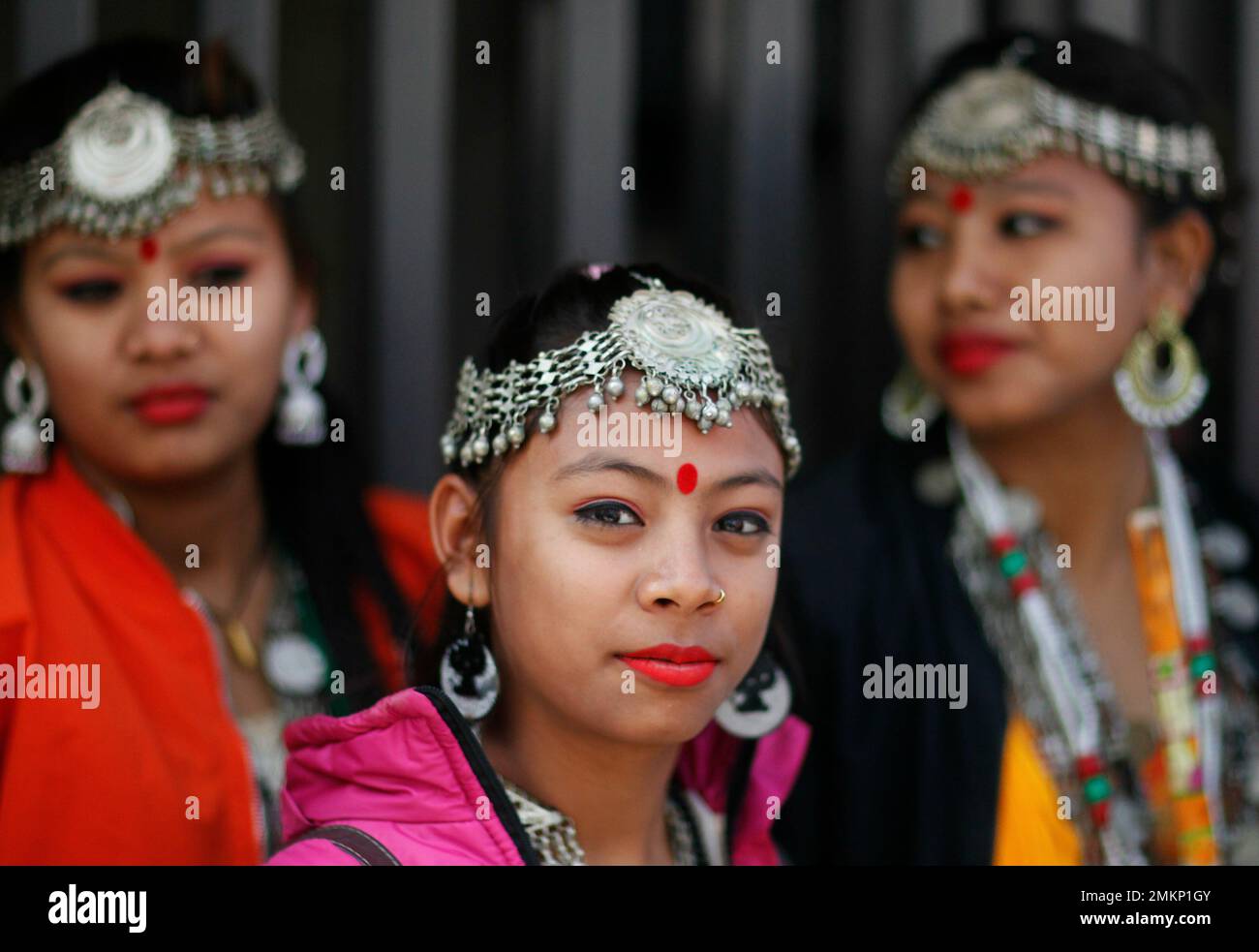 Nepalese ethnic Tharu community women in traditional attire get ready ...