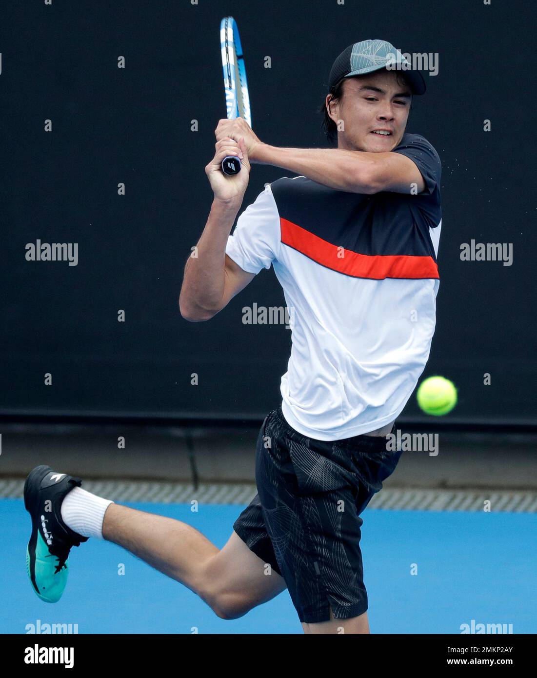 Japan's Taro Daniel hits a backhand return to Australia's Thanasi ...