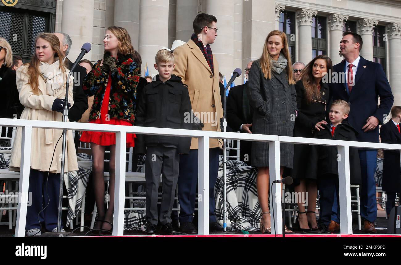 Oklahoma Governor Kevin Stitt, right, and his family, listen during ...