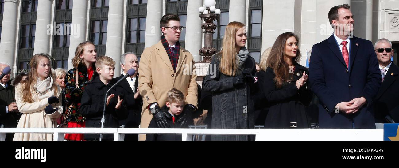 Oklahoma Governor Kevin Stitt, right, and his family, listen during ...