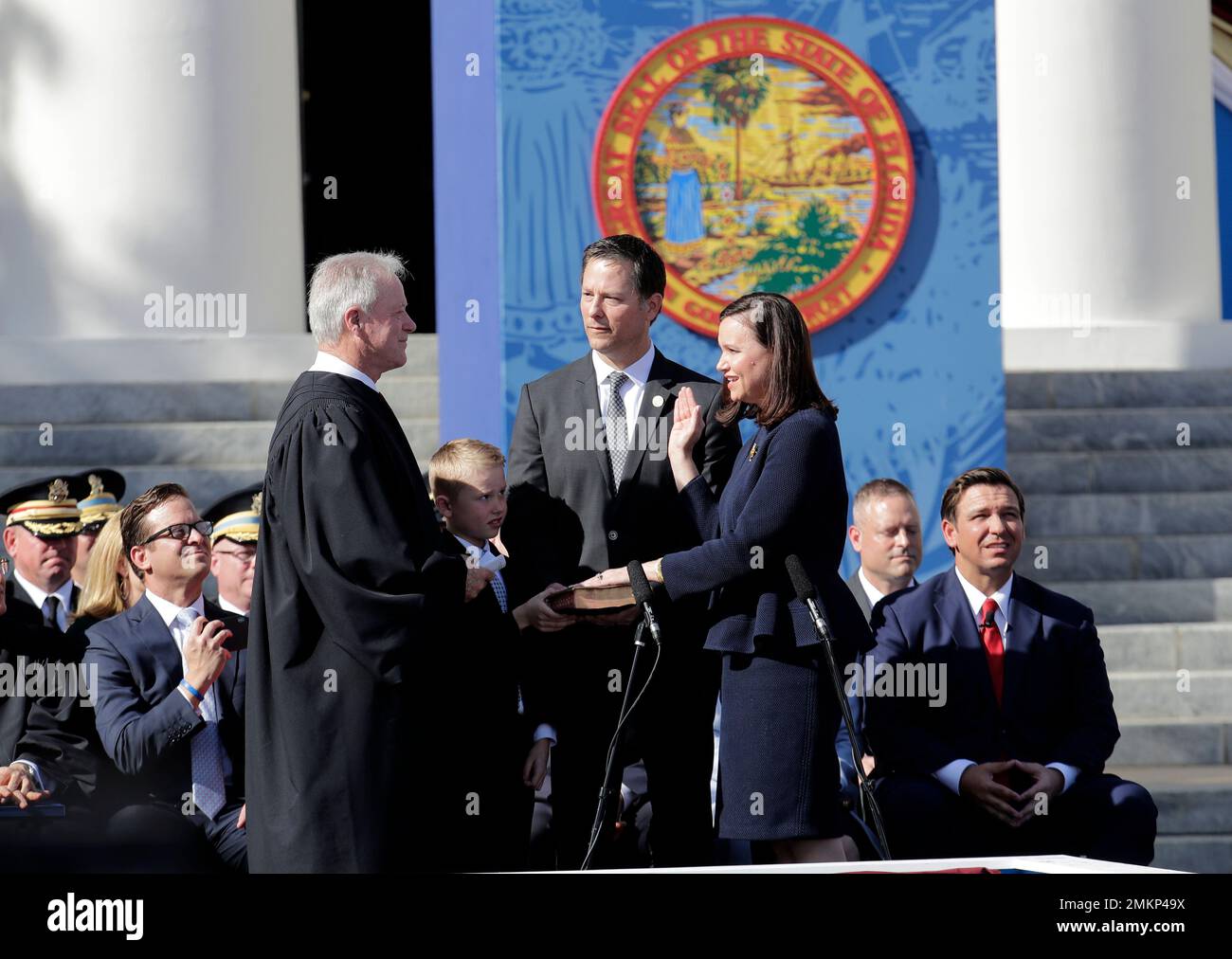 Ashley Moody, right, is sworn in as Florida Attorney General by Judge ...