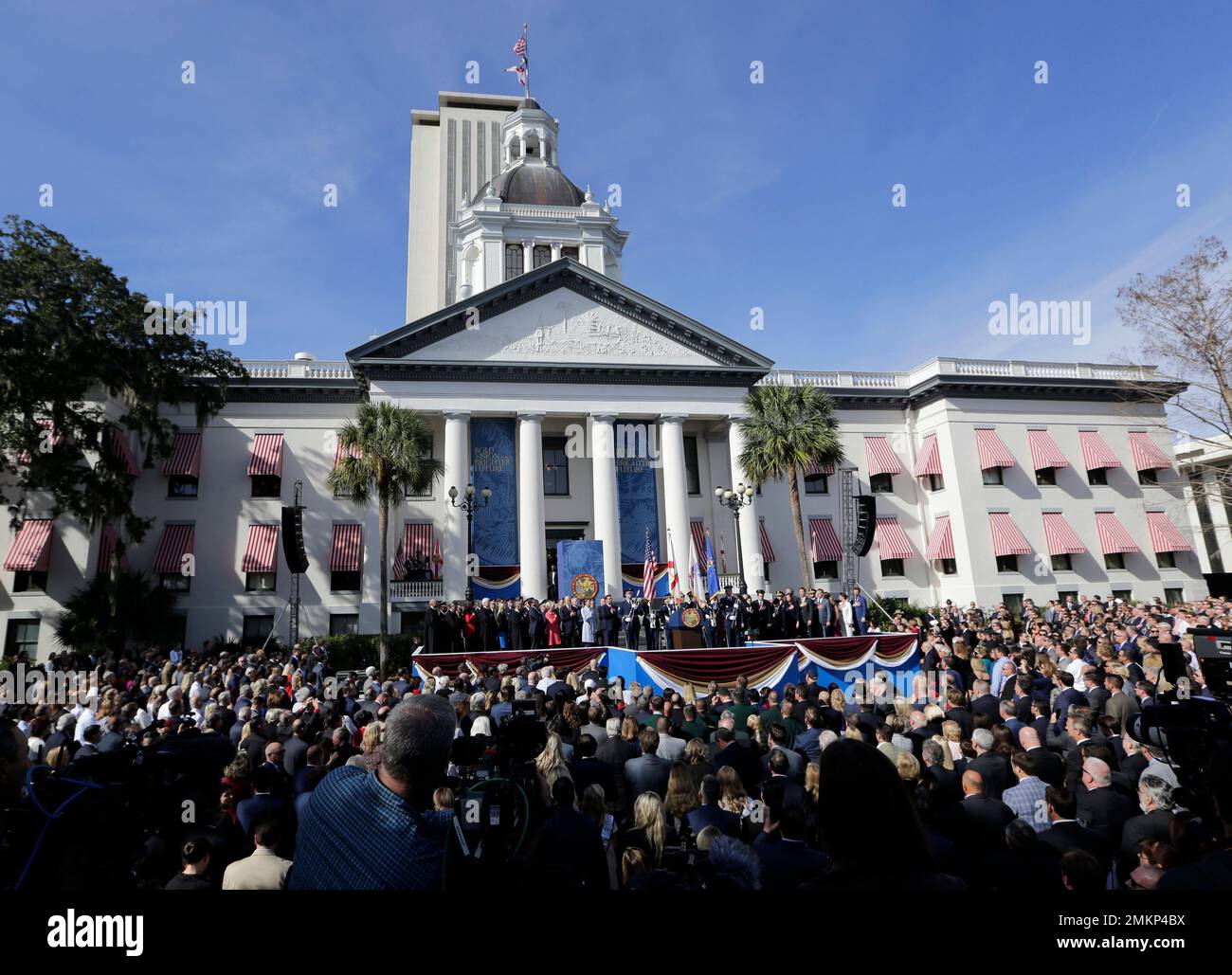 Florida Governor-elect Ron DeSantis and other officials stand in front ...