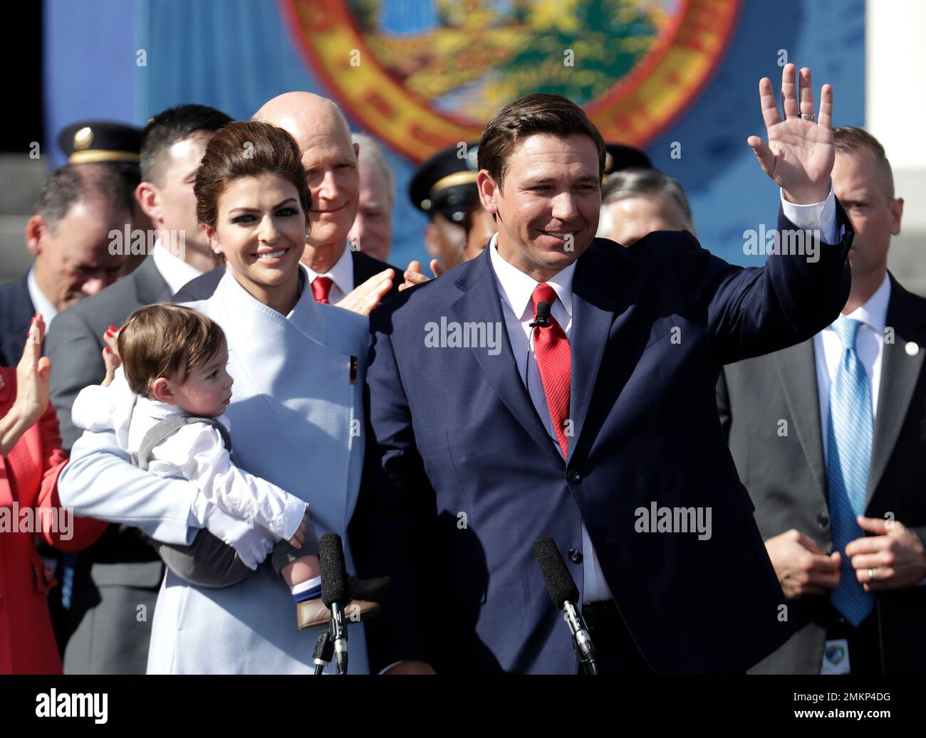 Florida Governor Ron DeSantis, right, waves during an inauguration ...