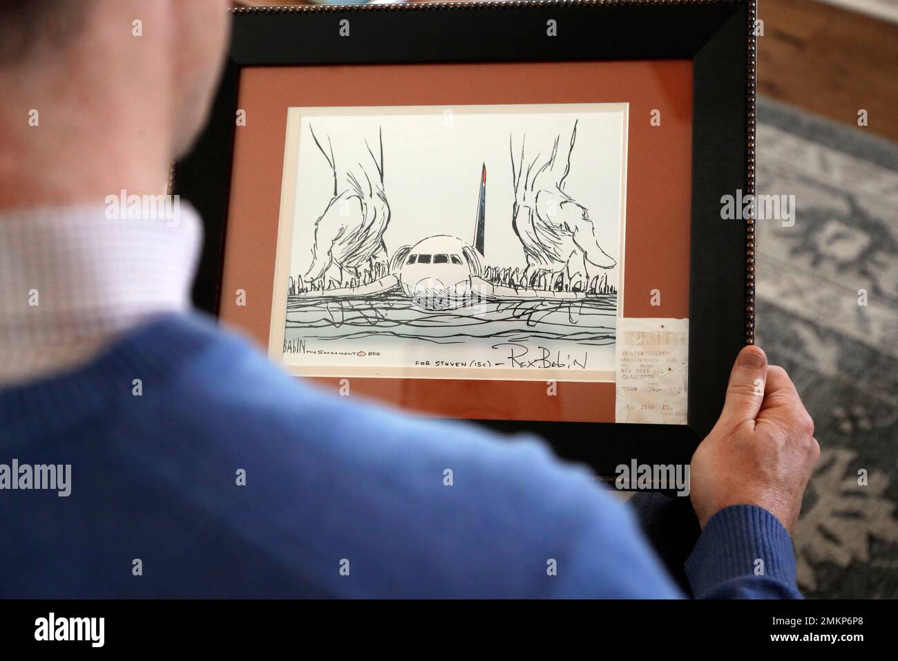 In this Jan. 10, 2019 photo, Steve O'Brien holds an editorial cartoon ...