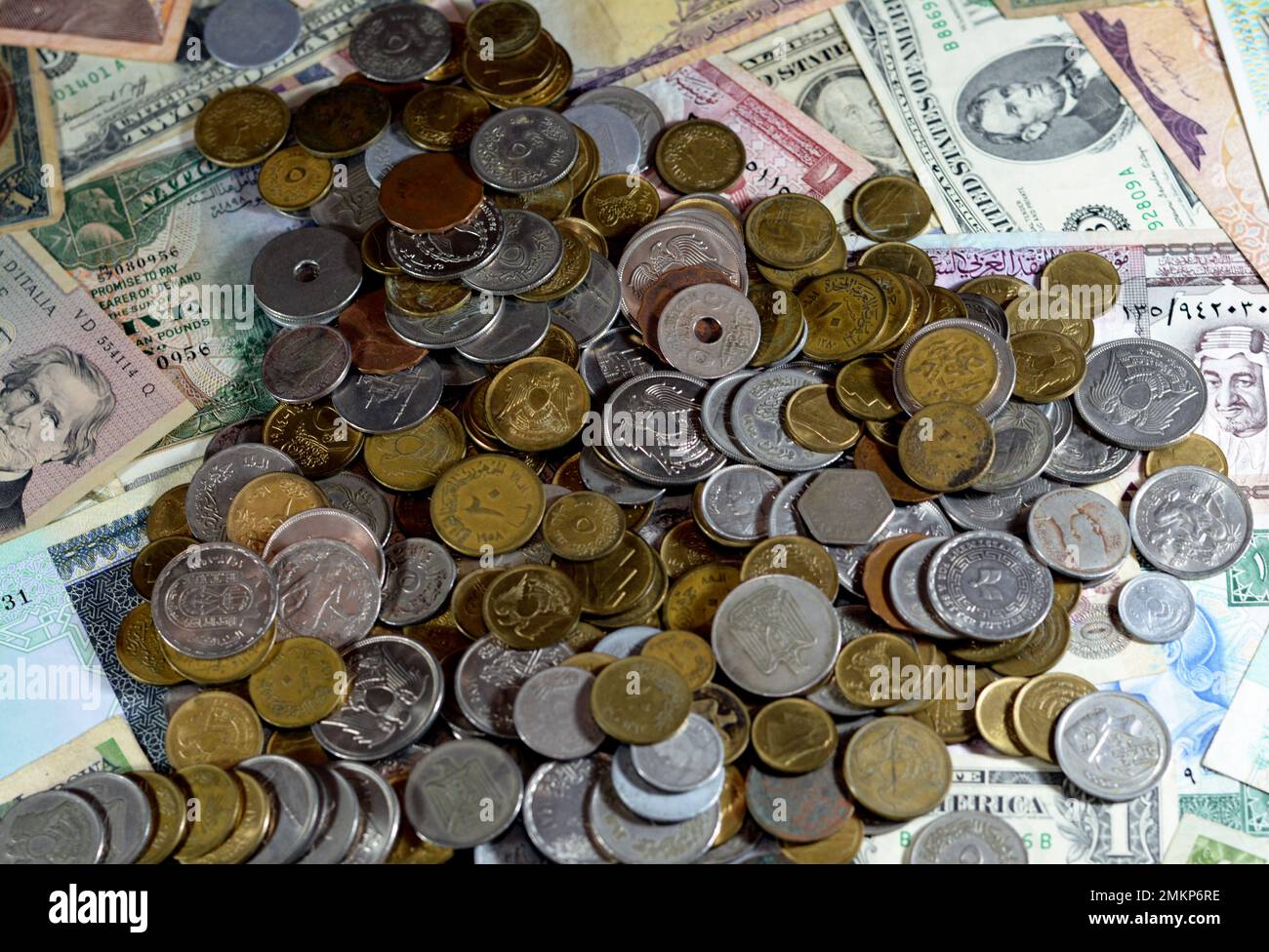 Old Egyptian coins on various old cash money banknotes from different ...