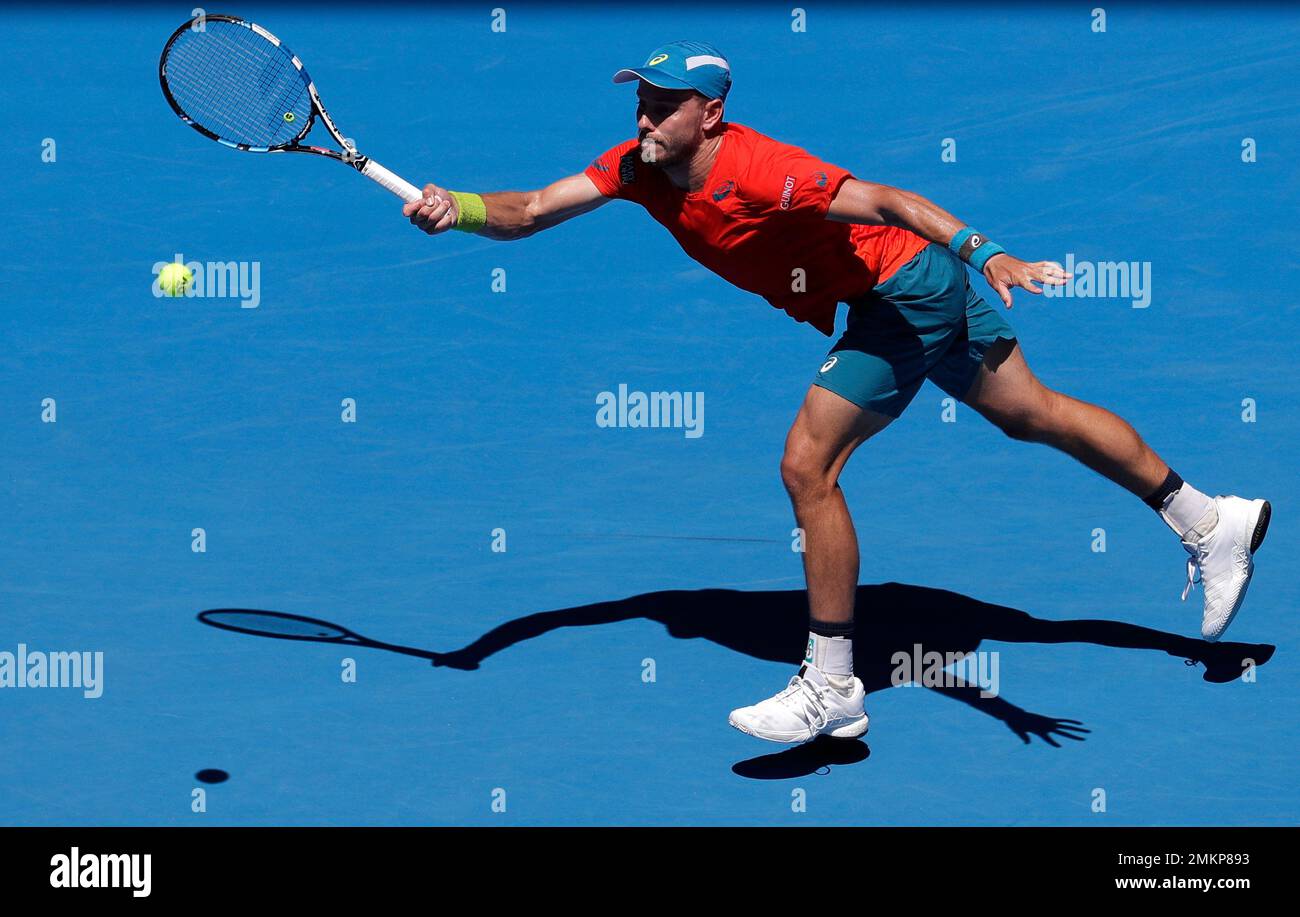 Australia's James Duckworth reaches for a forehand return to Spain's ...
