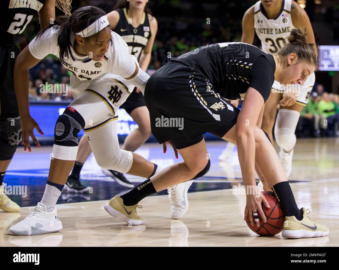 Wake Forest's Elisa Penna, right, grabs the ball next to Notre Dame's ...