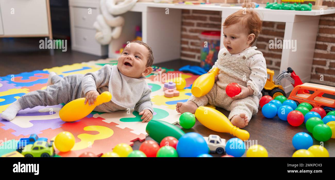 African baby playing with color toy hi-res stock photography and images ...