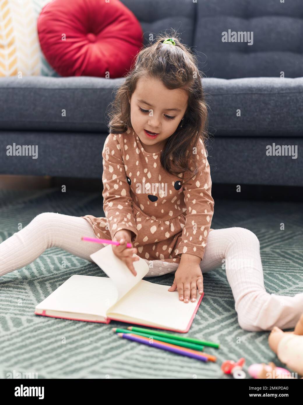 Adorable hispanic girl sitting on hi-res stock photography and images ...