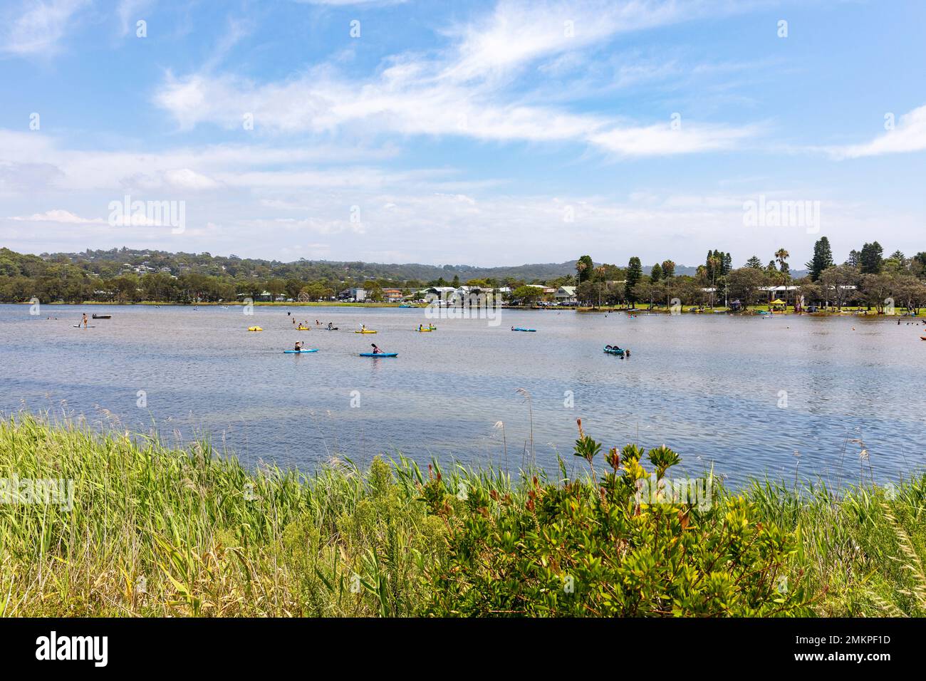 Sydney summers day, Narrabeen lake and lagoon, holidaymakers in kayaks ...
