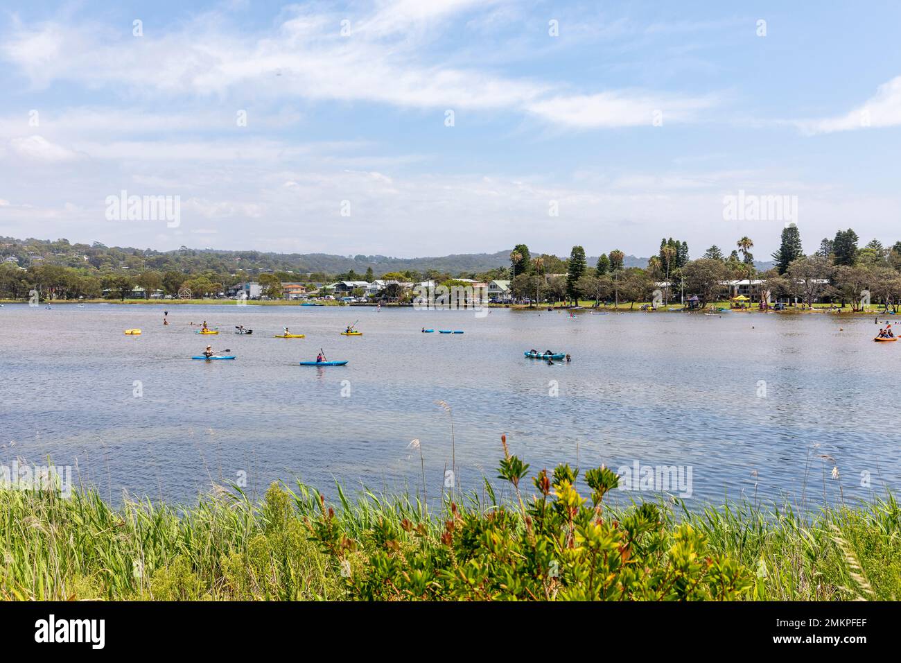Sydney summers day, Narrabeen lake and lagoon, holidaymakers in kayaks ...