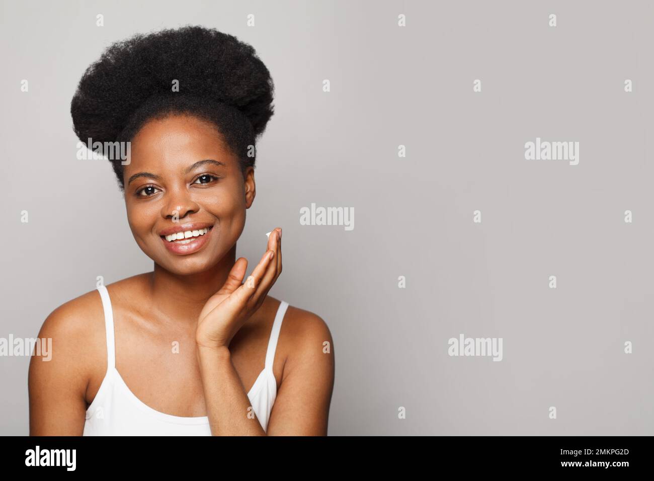 Pretty model woman with clean fresh smooth skin holding white ...