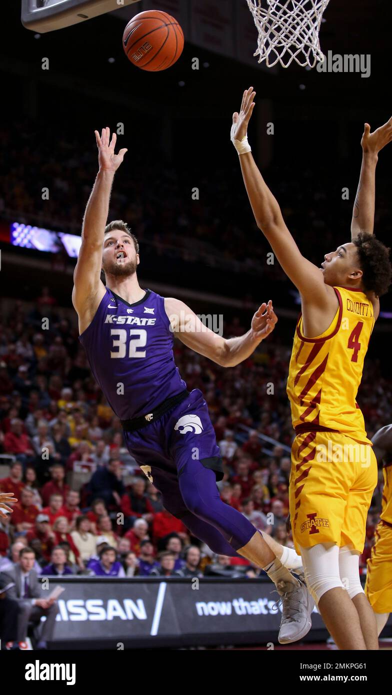 Kansas State forward Dean Wade puts up a shot over Iowa State forward ...
