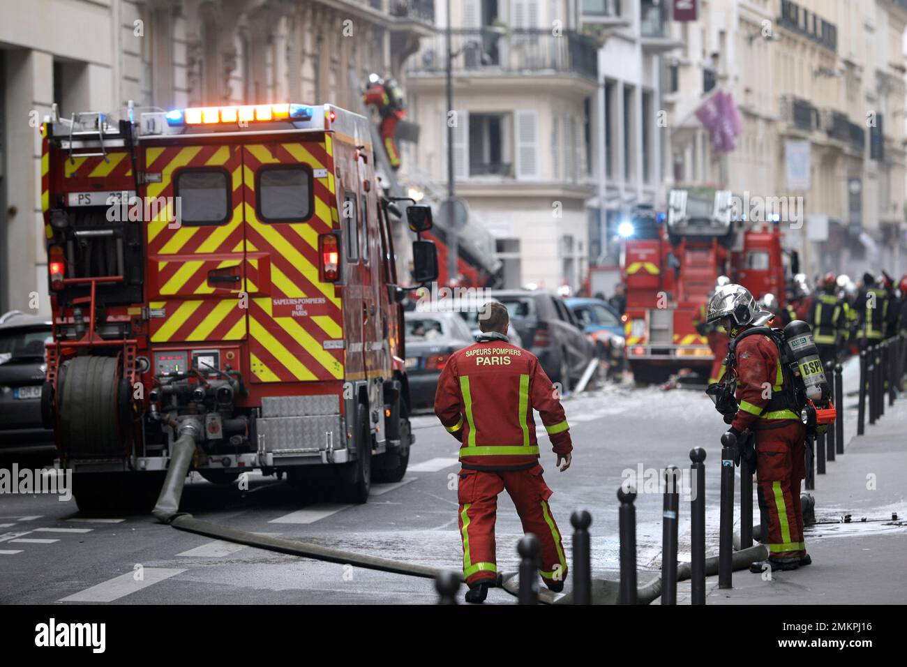 Firefighters work at the scene of a gas leak explosion in Paris, France ...