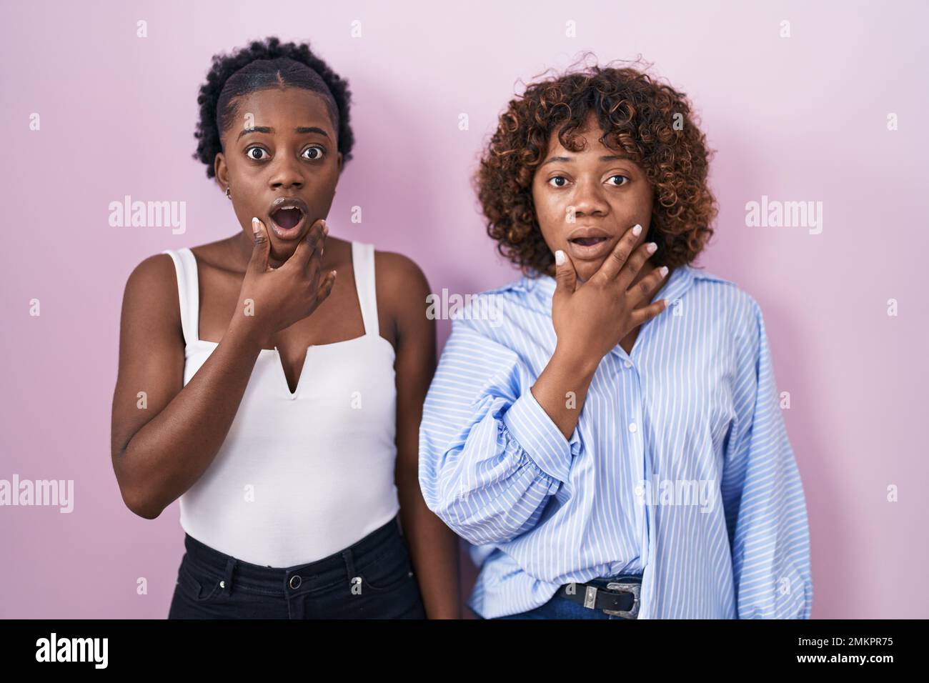 Shocked amazed astonished two women hi-res stock photography and images ...