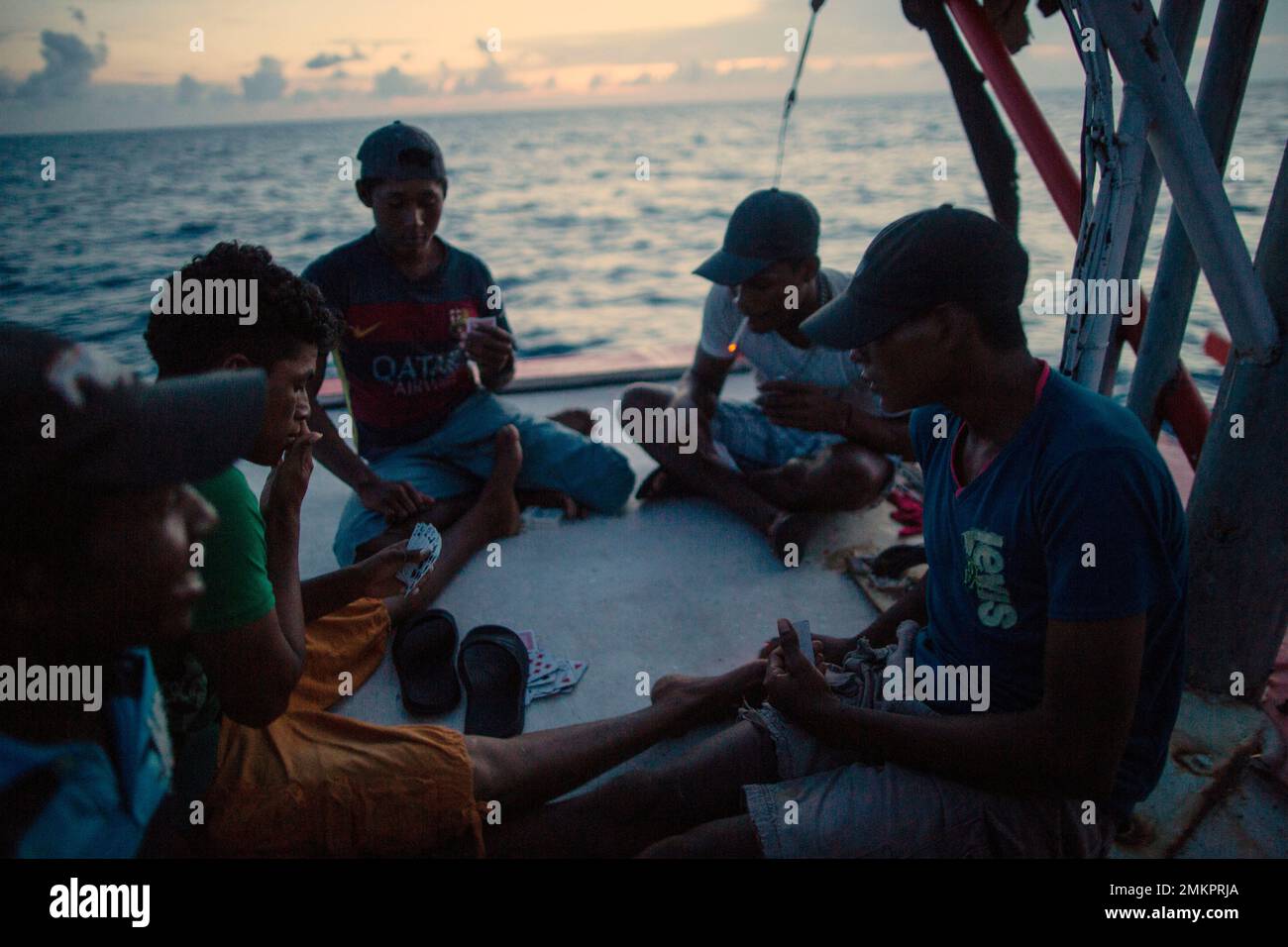 In this Sept. 10, 2018 photo, Miskito divers play a game of cards on a ...