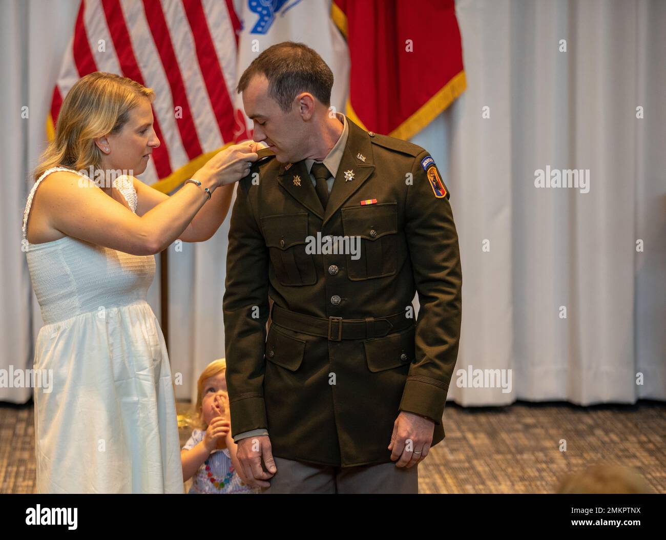 2nd Lt. Silas Proft is pinned his new rank by his wife, Kathleen, and ...