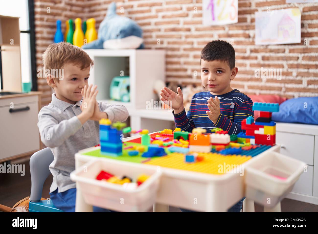 Hispanic kids playing with blocks hi-res stock photography and images ...
