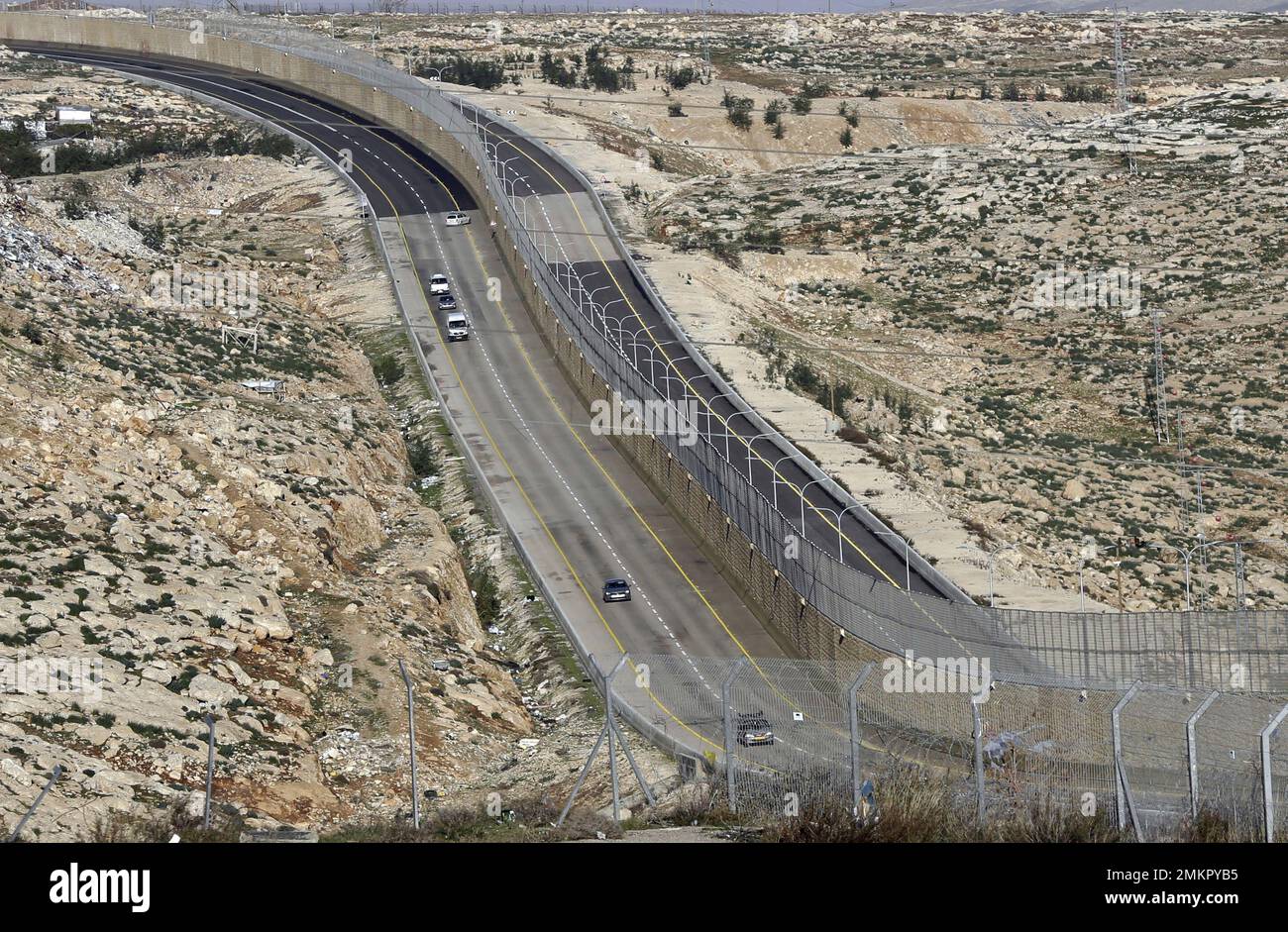 A newly opened segregated West Bank highway, right side of the wall, is ...
