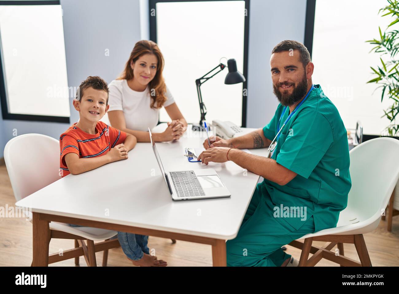 Family having medical consultation at clinic Stock Photo - Alamy