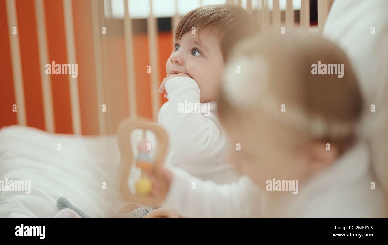 Toddlers sitting on bed together hi-res stock photography and images ...
