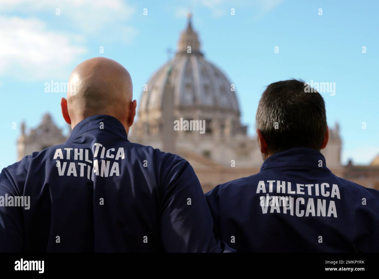 Athletes of the Athletica Vatican team pose for the media in front of ...