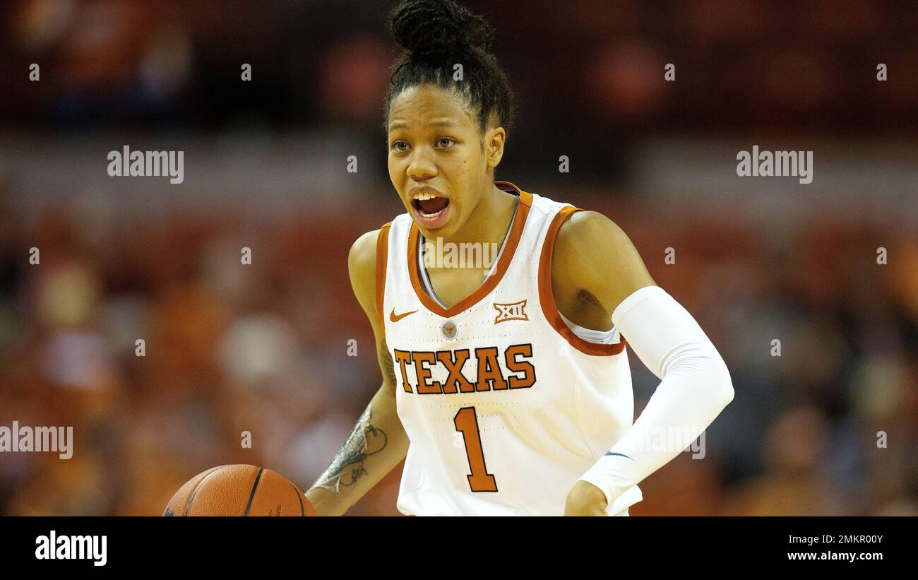Texas guard Sug Sutton (1) drives the ball down court during an NCAA ...